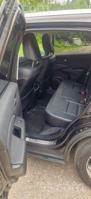 Brown Honda CR-V 2016 in Riga, with an engine capacity of 2.00 L and mileage of 196 thousand km for 15900 €, photo 12 on AUTOMOTO.COM.LV