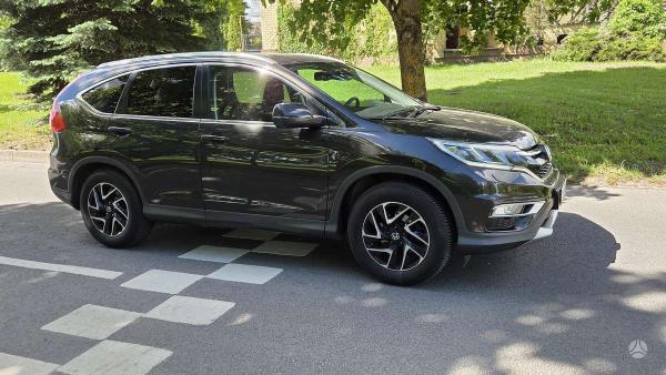 Brown Honda CR-V 2017 in Panevezys, with an engine capacity of 1.60 L and mileage of 260 thousand km for 11200 €, photo 9 on AUTOMOTO.COM.LV