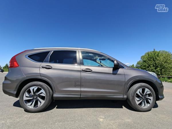 Honda CR-V 2015 in Vilnius, with an engine capacity of 1.60 L and mileage of 239 thousand km for 12800 €, photo 1 on AUTOMOTO.COM.LV