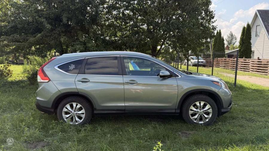 Green Honda CR-V 2012 in Panevezys, with an engine capacity of 2.35 L and mileage of 190 thousand km for 9500 €, photo 4 on AUTOMOTO.COM.LV