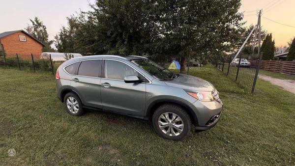 Green Honda CR-V 2012 in Panevezys, with an engine capacity of 2.35 L and mileage of 190 thousand km for 9500 €, photo 4 on AUTOMOTO.COM.LV