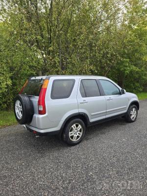 Pelēks Honda CR-V 2002 Rīga, ar dzinēja tilpumu 2.00 L un nobraukumu 249 tūkst. km par 1850 €, foto 4 vietnē AUTOMOTO.COM.LV
