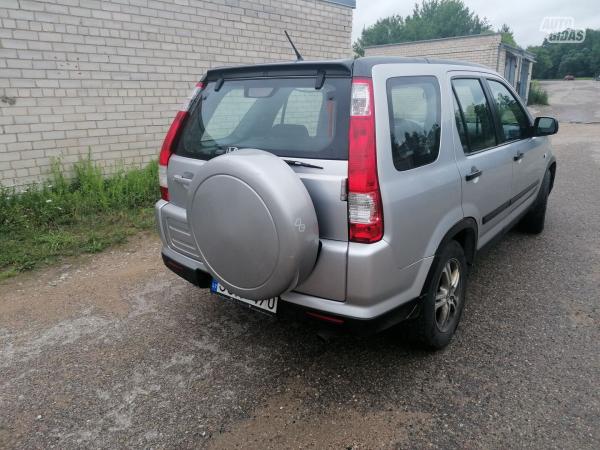 Grey Honda CR-V 2005 in Utena, with an engine capacity of 2.20 L and mileage of 396 thousand km for 1450 €, photo 7 on AUTOMOTO.COM.LV