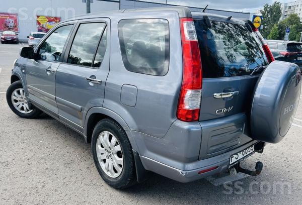 Pelēks Honda CR-V 2006 Rīga, ar dzinēja tilpumu 2.00 L un nobraukumu 404 tūkst. km par 2000 €, foto 4 vietnē AUTOMOTO.COM.LV