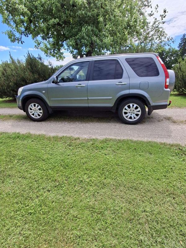 Grey Honda CR-V 2006 in Alytus, with an engine capacity of 2.20 L and mileage of 304 thousand km for 4000 €, photo 5 on AUTOMOTO.COM.LV