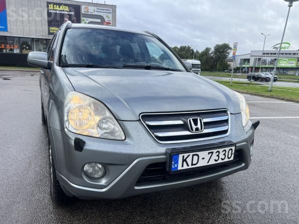 Grey Honda CR-V 2006 in Riga, with an engine capacity of 2.20 L and mileage of 315 thousand km for 3500 €, photo 10 on AUTOMOTO.COM.LV