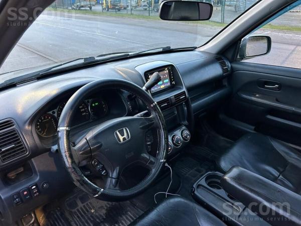 Pelēks Honda CR-V 2006 Rīga, ar dzinēja tilpumu 2.00 L un nobraukumu 346 tūkst. km par 3150 €, foto 4 vietnē AUTOMOTO.COM.LV