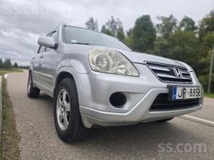 Grey Honda CR-V 2006 in Daugavpils, with an engine capacity of 2.20 L and mileage of 0 thousand km for 1499 €, photo 3 on AUTOMOTO.COM.LV