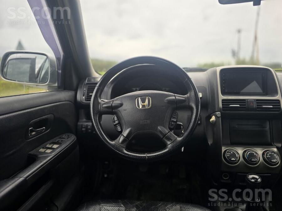 Grey Honda CR-V 2006 in Daugavpils, with an engine capacity of 2.20 L and mileage of 0 thousand km for 1499 €, photo 10 on AUTOMOTO.COM.LV