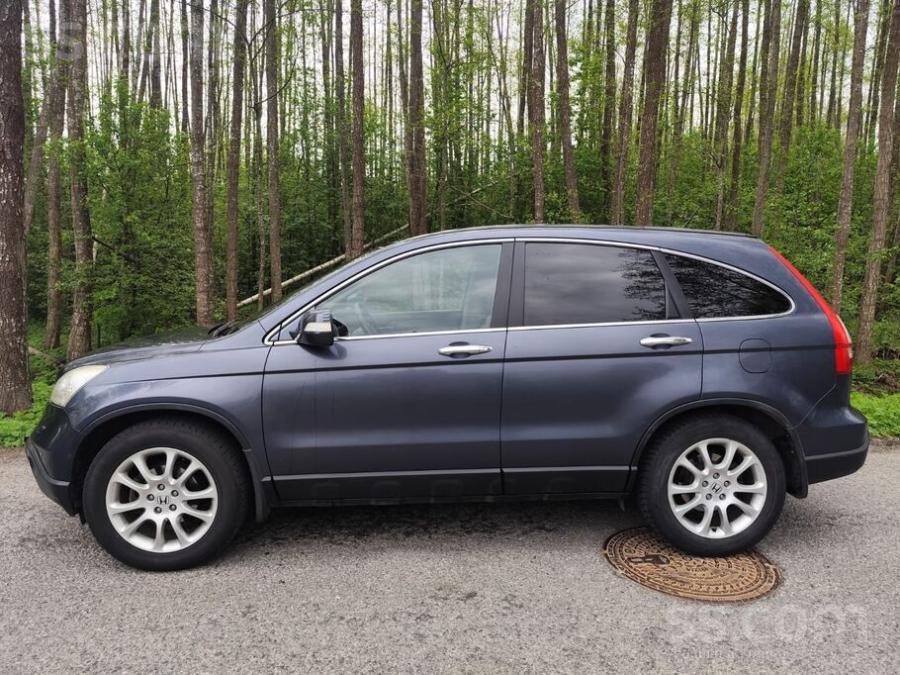Pelēks Honda CR-V 2007 Rīga, ar dzinēja tilpumu 2.20 L un nobraukumu 303 tūkst. km par 3200 €, foto 3 vietnē AUTOMOTO.COM.LV