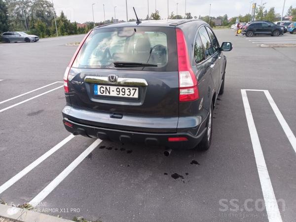 Grey Honda CR-V 2007 in Riga, with an engine capacity of 2.00 L and mileage of 239 thousand km for 1950 €, photo 2 on AUTOMOTO.COM.LV