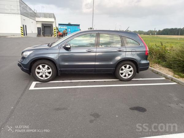 Grey Honda CR-V 2007 in Riga, with an engine capacity of 2.00 L and mileage of 239 thousand km for 1950 €, photo 5 on AUTOMOTO.COM.LV