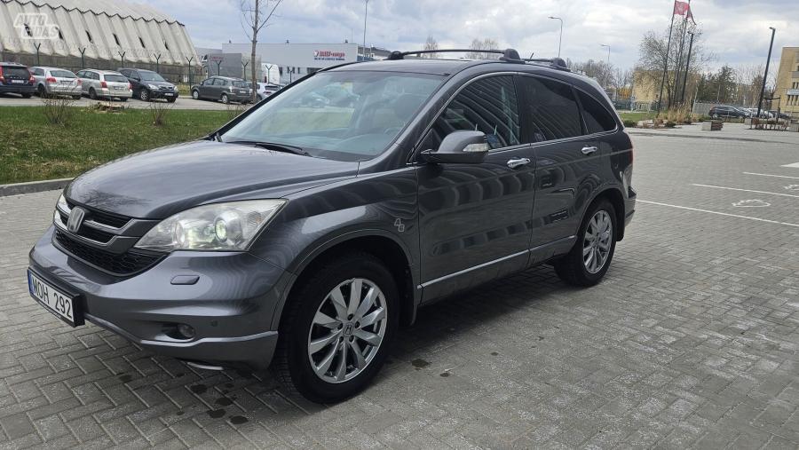 Grey Honda CR-V 2011 in Vilnius, with an engine capacity of 2.20 L and mileage of 217 thousand km for 7890 €, photo 3 on AUTOMOTO.COM.LV