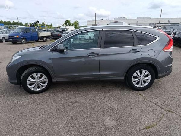 Grey Honda CR-V 2012 in Panevezys, with an engine capacity of 2.20 L and mileage of 250 thousand km for 8900 €, photo 2 on AUTOMOTO.COM.LV