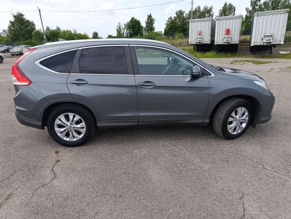 Grey Honda CR-V 2012 in Panevezys, with an engine capacity of 2.20 L and mileage of 250 thousand km for 8900 €, photo 5 on AUTOMOTO.COM.LV