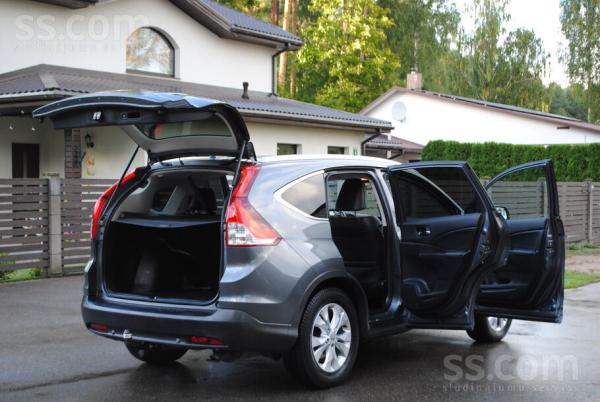 Grey Honda CR-V 2012 in Riga, with an engine capacity of 2.20 L and mileage of 239 thousand km for 10490 €, photo 7 on AUTOMOTO.COM.LV