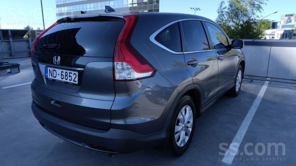 Grey Honda CR-V 2013 in Riga, with an engine capacity of 2.00 L and mileage of 210 thousand km for 5000 €, photo 5 on AUTOMOTO.COM.LV