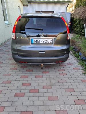 Grey Honda CR-V 2013 in Riga, with an engine capacity of 2.20 L and mileage of 0 thousand km for 10800 €, photo 4 on AUTOMOTO.COM.LV