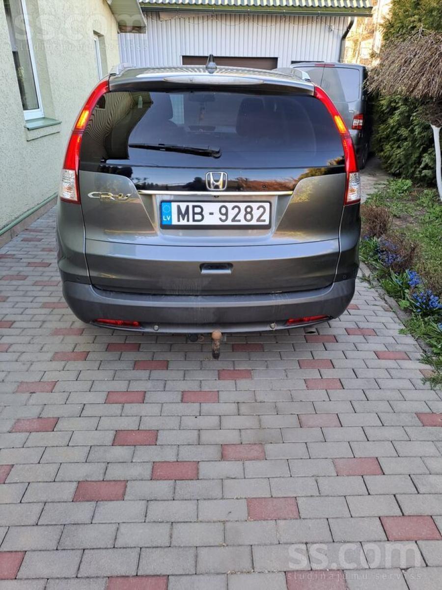 Grey Honda CR-V 2013 in Riga, with an engine capacity of 2.20 L and mileage of 0 thousand km for 10800 €, photo 4 on AUTOMOTO.COM.LV