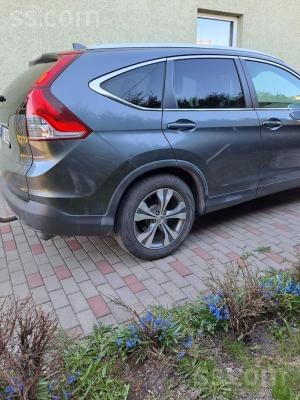 Grey Honda CR-V 2013 in Riga, with an engine capacity of 2.20 L and mileage of 0 thousand km for 10800 €, photo 5 on AUTOMOTO.COM.LV