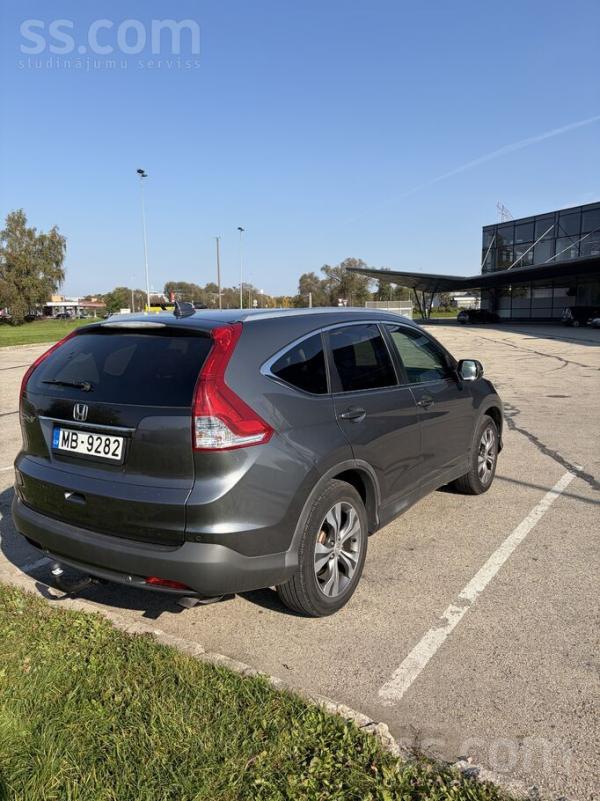 Grey Honda CR-V 2013 in Riga, with an engine capacity of 2.20 L and mileage of 214 thousand km for 9200 €, photo 4 on AUTOMOTO.COM.LV