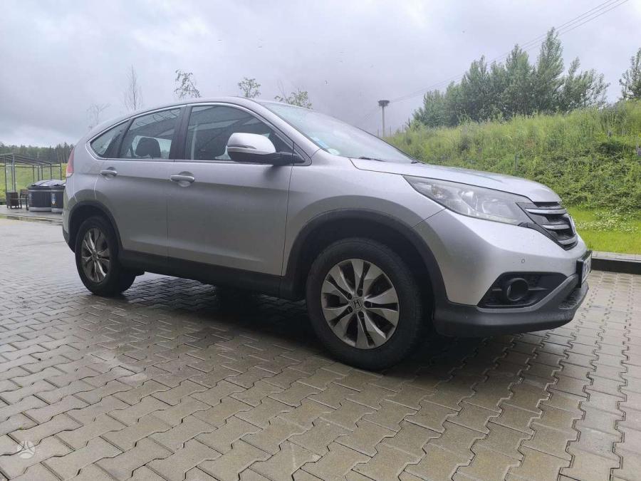 Grey Honda CR-V 2013 in Vilnius, with an engine capacity of 2.20 L and mileage of 228 thousand km for 8300 €, photo 3 on AUTOMOTO.COM.LV