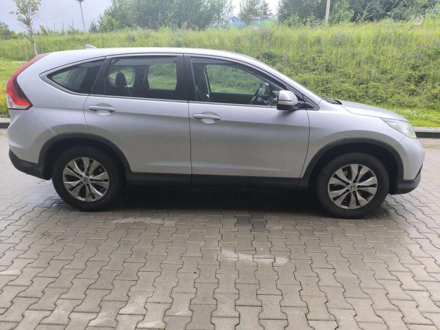 Grey Honda CR-V 2013 in Vilnius, with an engine capacity of 2.20 L and mileage of 228 thousand km for 8300 €, photo 5 on AUTOMOTO.COM.LV