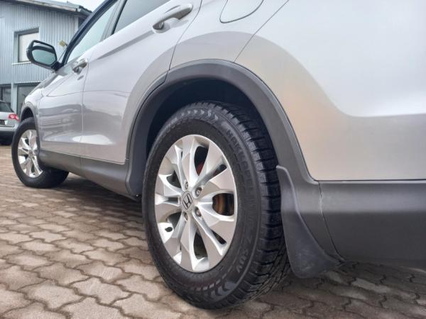 Grey Honda CR-V 2013 in Riga, with an engine capacity of 2.20 L and mileage of 240 thousand km for 9900 €, photo 9 on AUTOMOTO.COM.LV
