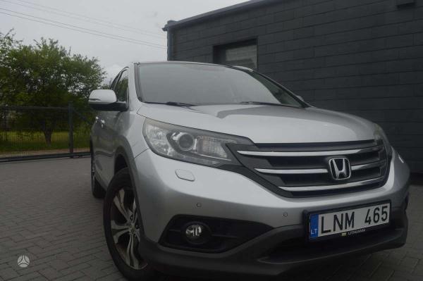 Grey Honda CR-V 2013 in Vilnius, with an engine capacity of 2.20 L and mileage of 213 thousand km for 11500 €, photo 3 on AUTOMOTO.COM.LV