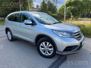 Grey Honda CR-V 2013 in Ogre, with an engine capacity of 2.00 L and mileage of 258 thousand km for 8550 €, photo 4 on AUTOMOTO.COM.LV