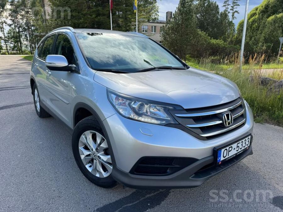 Grey Honda CR-V 2013 in Ogre, with an engine capacity of 2.00 L and mileage of 258 thousand km for 8550 €, photo 6 on AUTOMOTO.COM.LV