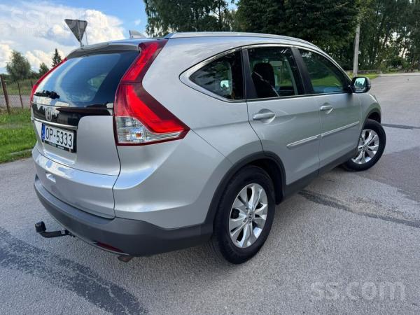 Grey Honda CR-V 2013 in Ogre, with an engine capacity of 2.00 L and mileage of 258 thousand km for 8550 €, photo 6 on AUTOMOTO.COM.LV