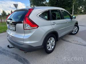 Grey Honda CR-V 2013 in Ogre, with an engine capacity of 2.00 L and mileage of 258 thousand km for 8550 €, photo 7 on AUTOMOTO.COM.LV