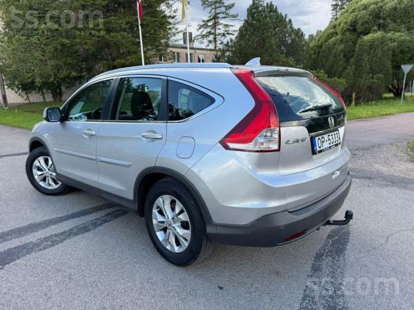 Grey Honda CR-V 2013 in Ogre, with an engine capacity of 2.00 L and mileage of 258 thousand km for 8550 €, photo 9 on AUTOMOTO.COM.LV