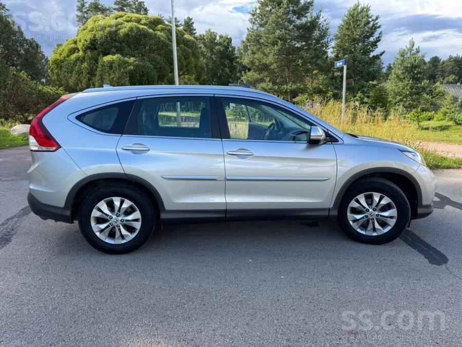 Grey Honda CR-V 2013 in Ogre, with an engine capacity of 2.00 L and mileage of 258 thousand km for 8550 €, photo 12 on AUTOMOTO.COM.LV