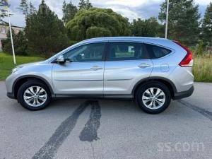 Grey Honda CR-V 2013 in Ogre, with an engine capacity of 2.00 L and mileage of 258 thousand km for 8550 €, photo 13 on AUTOMOTO.COM.LV