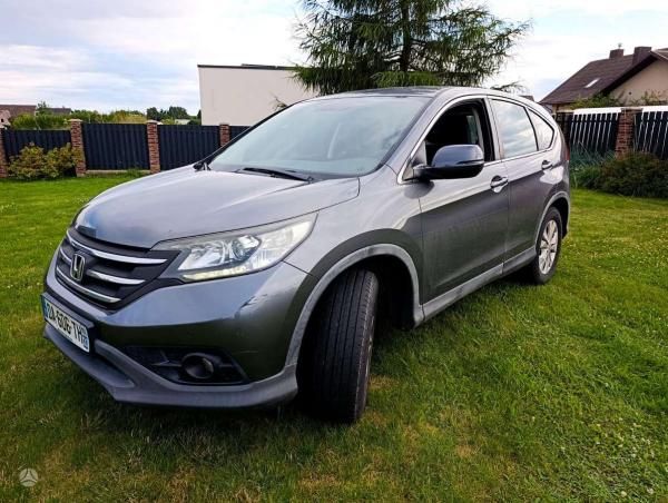 Grey Honda CR-V 2013 in Vievis, with an engine capacity of 1.60 L and mileage of 227 thousand km for 7000 €, photo 1 on AUTOMOTO.COM.LV