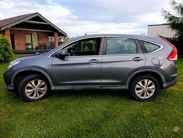 Grey Honda CR-V 2013 in Vievis, with an engine capacity of 1.60 L and mileage of 227 thousand km for 7000 €, photo 2 on AUTOMOTO.COM.LV