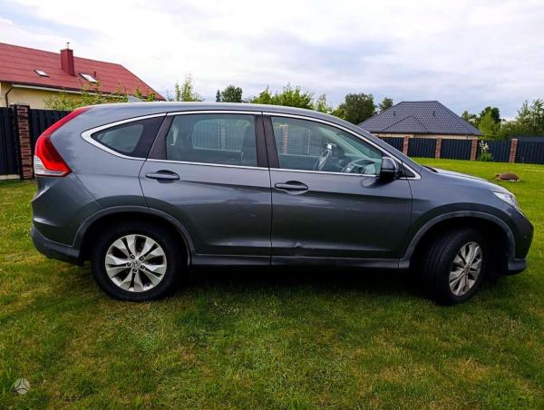 Grey Honda CR-V 2013 in Vievis, with an engine capacity of 1.60 L and mileage of 227 thousand km for 7000 €, photo 6 on AUTOMOTO.COM.LV
