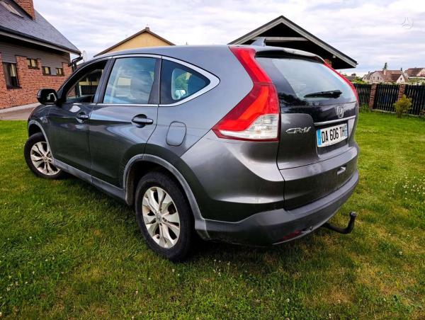 Grey Honda CR-V 2013 in Vievis, with an engine capacity of 1.60 L and mileage of 227 thousand km for 7000 €, photo 9 on AUTOMOTO.COM.LV
