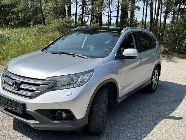 Grey Honda CR-V 2013 in Ukmerge, with an engine capacity of 2.20 L and mileage of 265 thousand km for 7950 €, photo 1 on AUTOMOTO.COM.LV