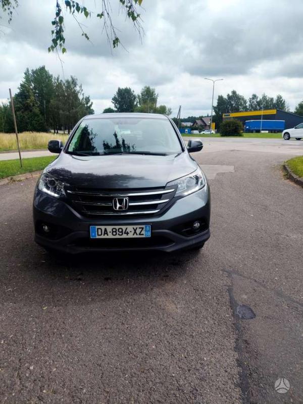 Grey Honda CR-V 2013 in Taurage, with an engine capacity of 1.60 L and mileage of 176 thousand km for 8600 €, photo 1 on AUTOMOTO.COM.LV