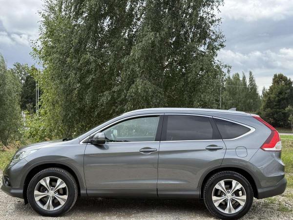 Grey Honda CR-V 2013 in Siauliai, with an engine capacity of 2.20 L and mileage of 284 thousand km for 12999 €, photo 4 on AUTOMOTO.COM.LV