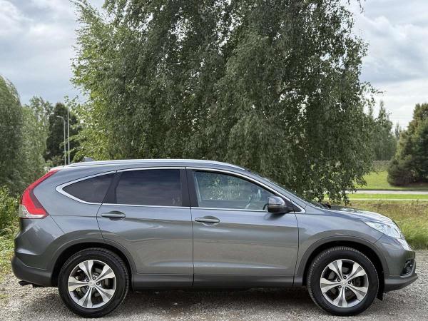 Grey Honda CR-V 2013 in Siauliai, with an engine capacity of 2.20 L and mileage of 284 thousand km for 12999 €, photo 5 on AUTOMOTO.COM.LV