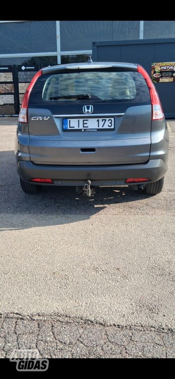 Grey Honda CR-V 2013 in Klaipeda, with an engine capacity of 2.20 L and mileage of 207 thousand km for 8499 €, photo 5 on AUTOMOTO.COM.LV