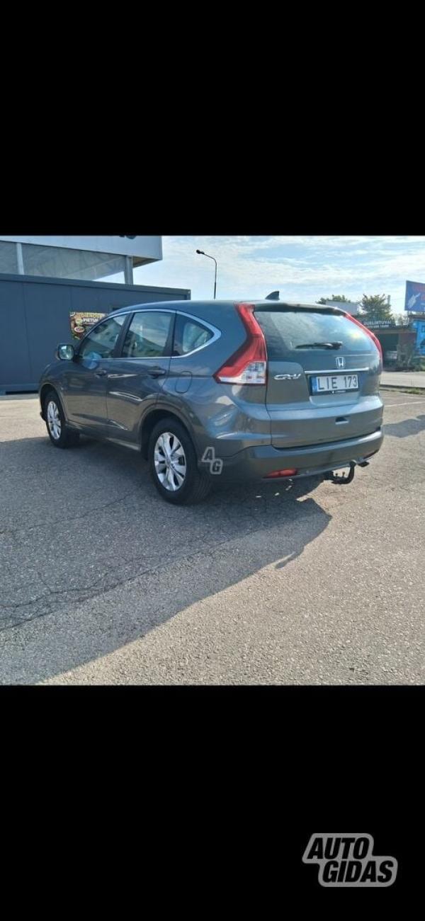 Grey Honda CR-V 2013 in Klaipeda, with an engine capacity of 2.20 L and mileage of 207 thousand km for 8499 €, photo 6 on AUTOMOTO.COM.LV
