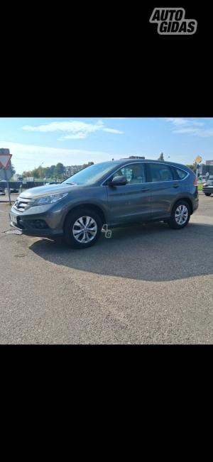 Grey Honda CR-V 2013 in Klaipeda, with an engine capacity of 2.20 L and mileage of 207 thousand km for 8499 €, photo 7 on AUTOMOTO.COM.LV