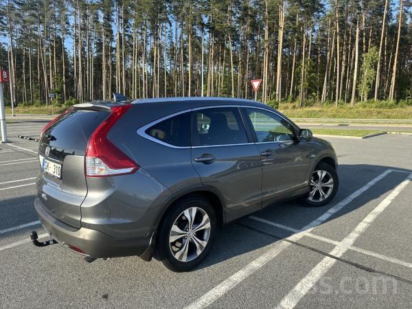 Grey Honda CR-V 2014 in Riga, with an engine capacity of 2.20 L and mileage of 184 thousand km for 10700 €, photo 2 on AUTOMOTO.COM.LV