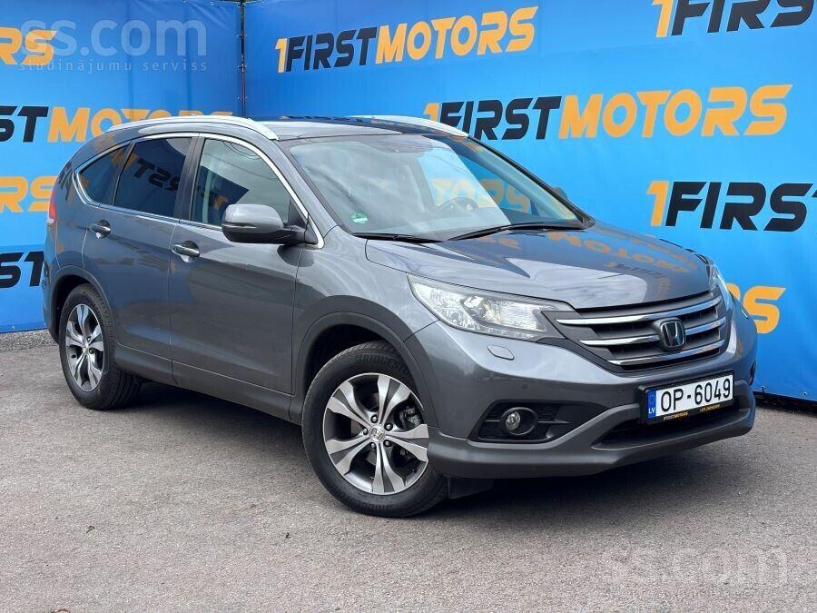 Grey Honda CR-V 2014 in Riga, with an engine capacity of 2.20 L and mileage of 274 thousand km for 9950 €, photo 6 on AUTOMOTO.COM.LV