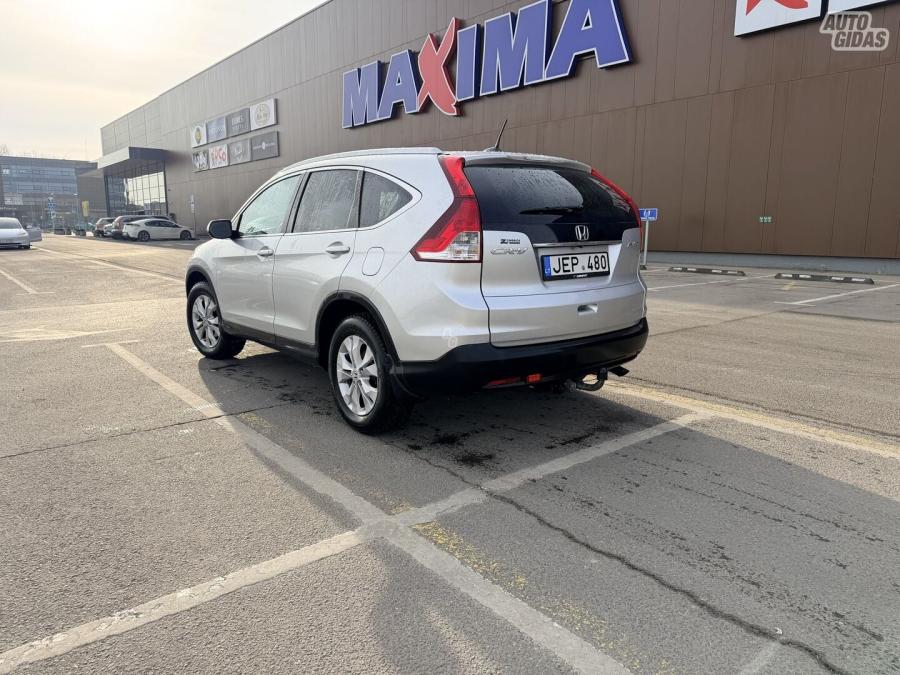 Grey Honda CR-V 2014 in Kaunas, with an engine capacity of 2.40 L and mileage of 95 thousand km for 11000 €, photo 6 on AUTOMOTO.COM.LV